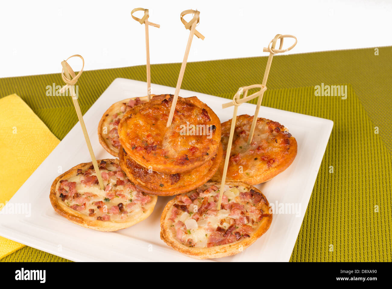 An assortment of freshly made mini pizzas Stock Photo - Alamy