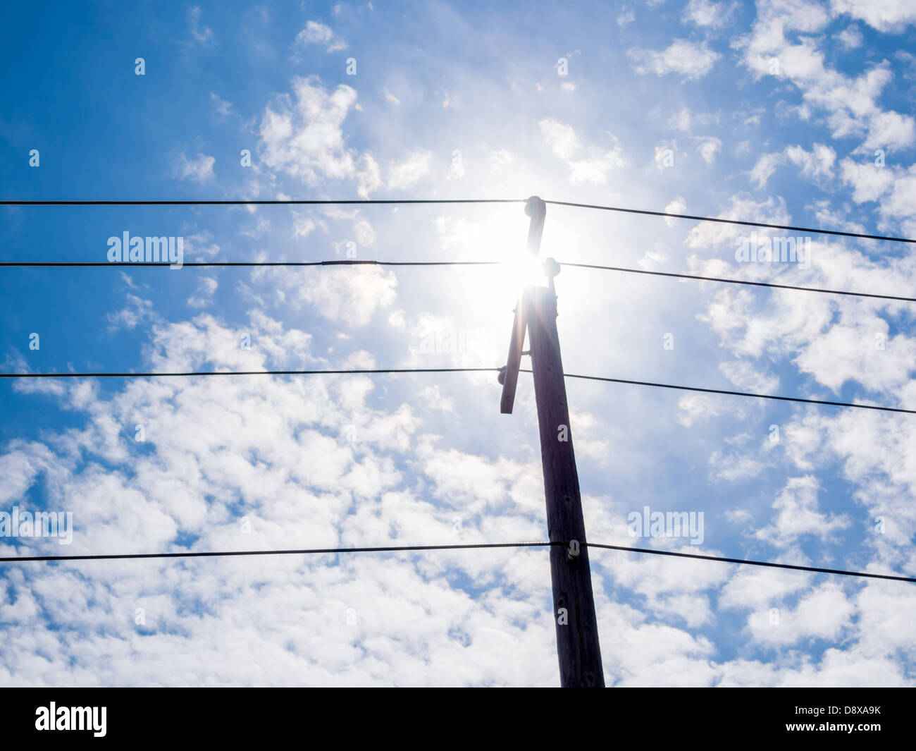power lines against blue sky Stock Photo - Alamy