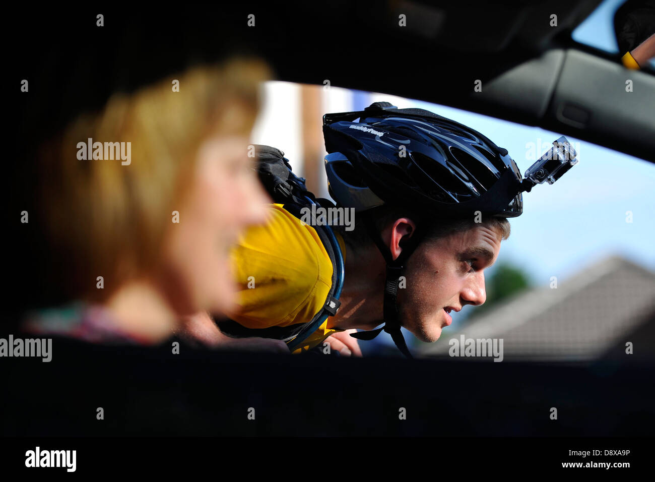 A cyclist wearing a gopro helmet camera Stock Photo - Alamy