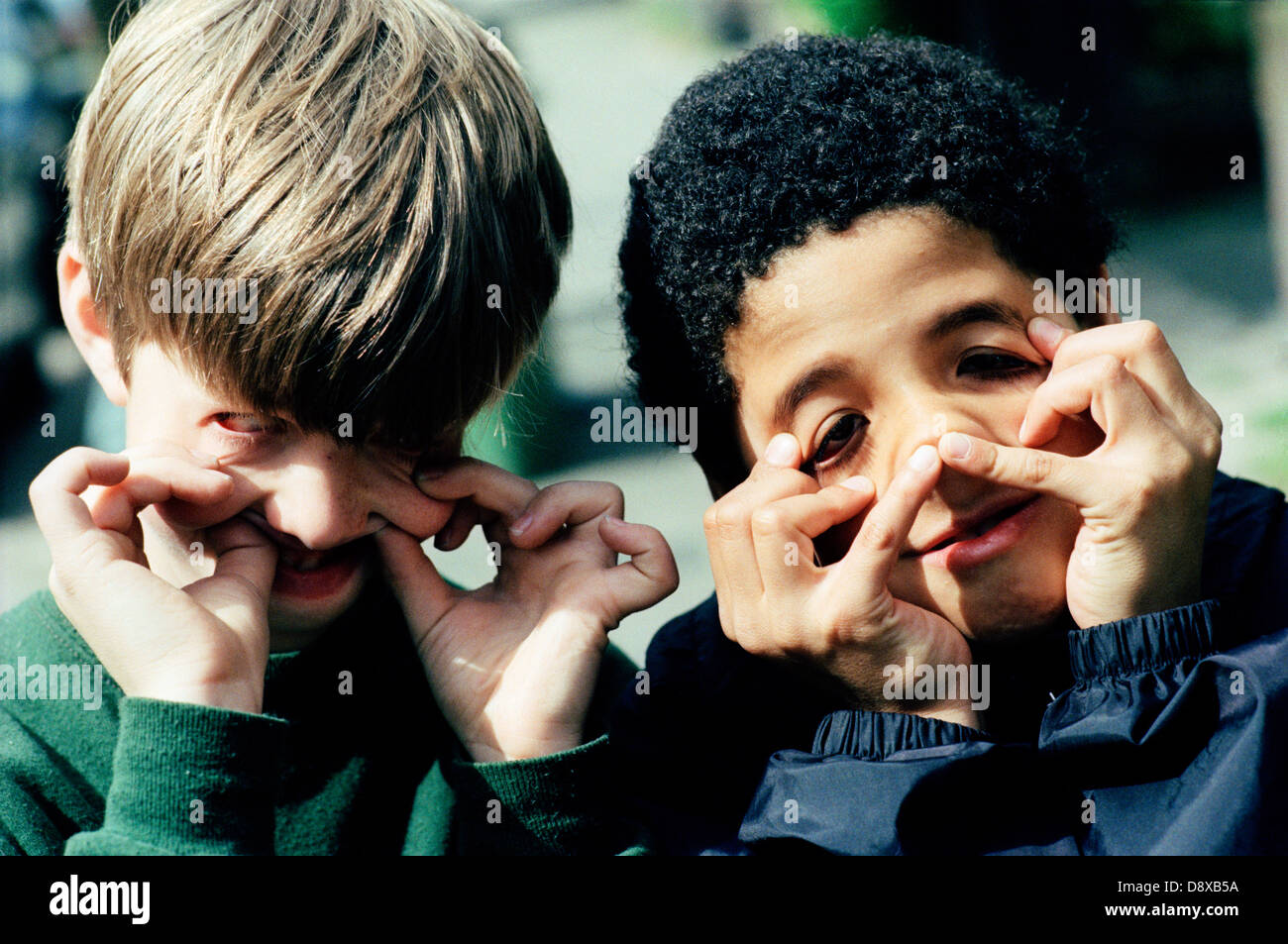 Two boys making faces Stock Photo - Alamy