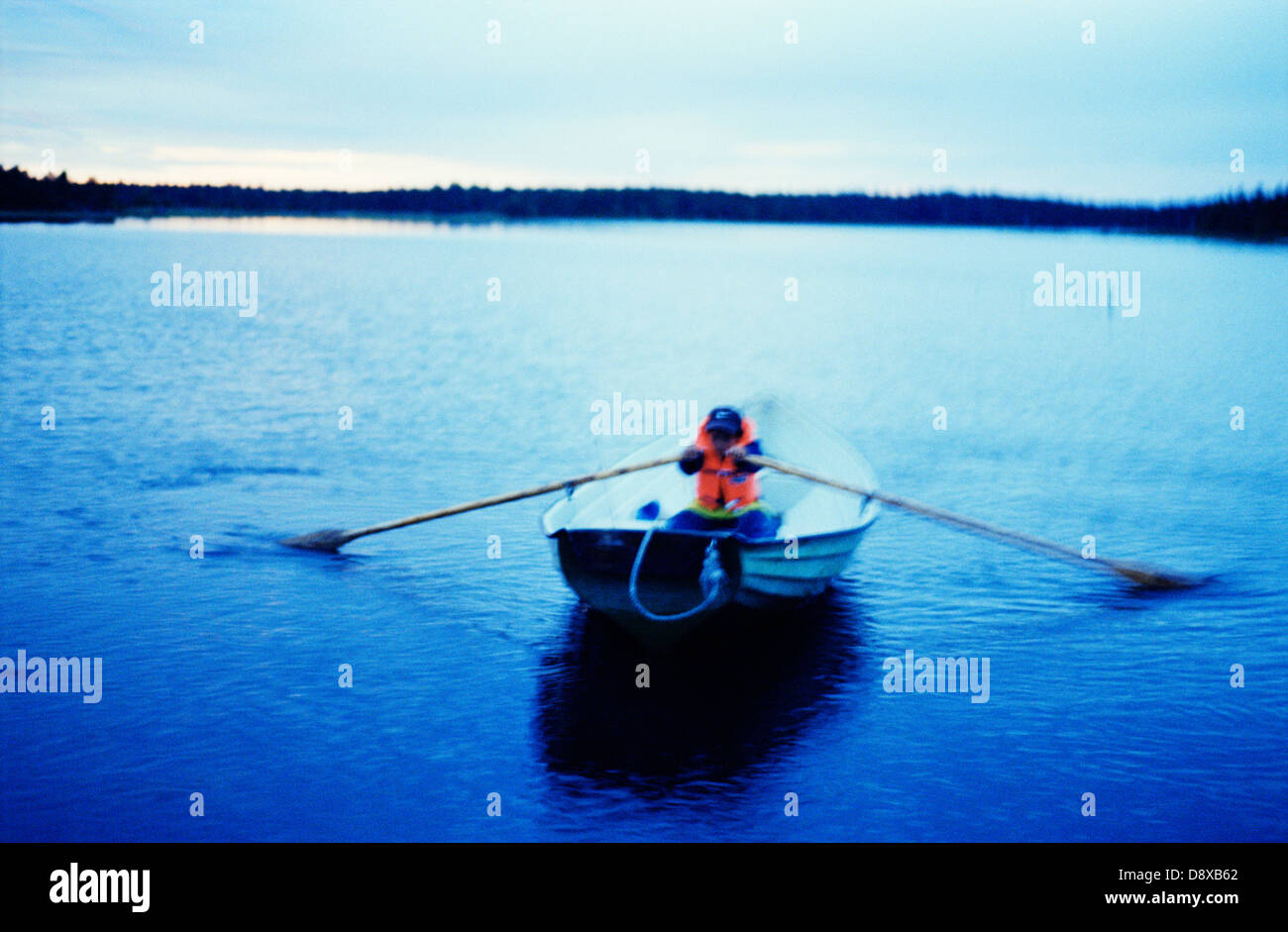 A Child Rowing a Boat Stock Photo - Alamy