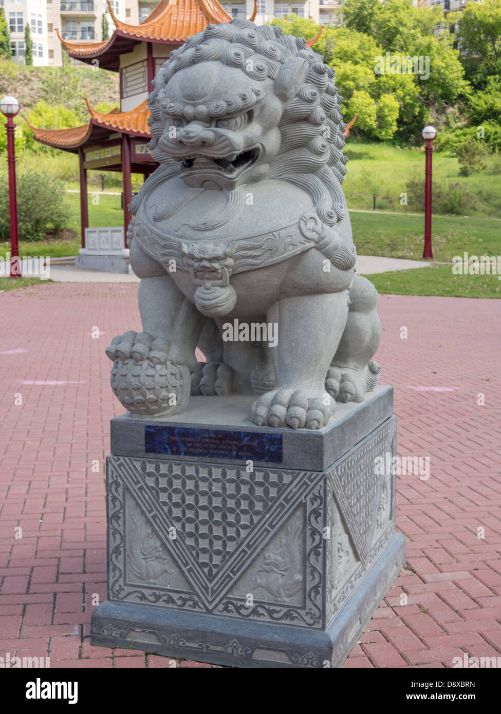 Chinese stone lion in Edmonton Chinese garden Stock Photo - Alamy