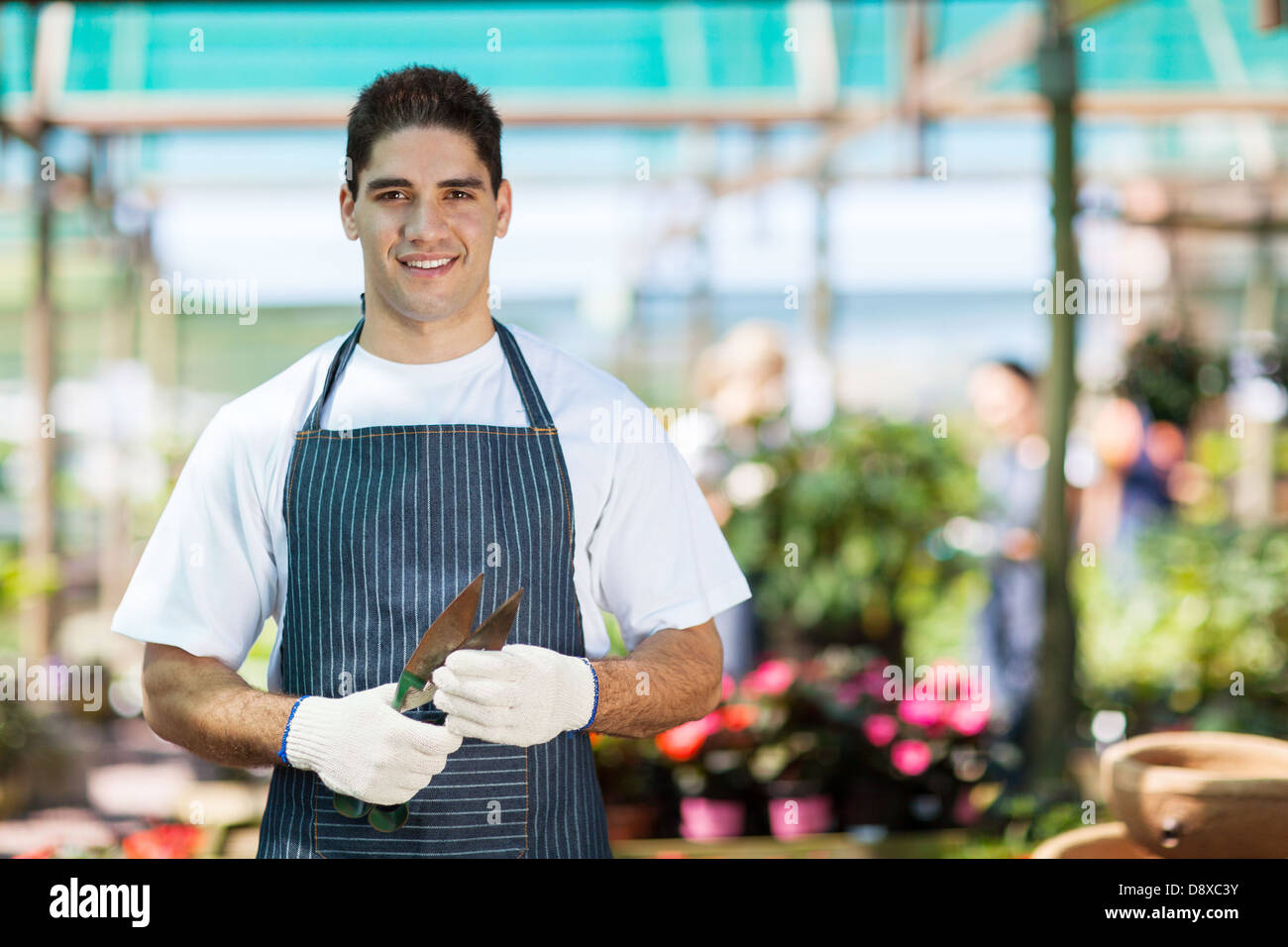 handsome young gardener portrait in greenhouse Stock Photo - Alamy
