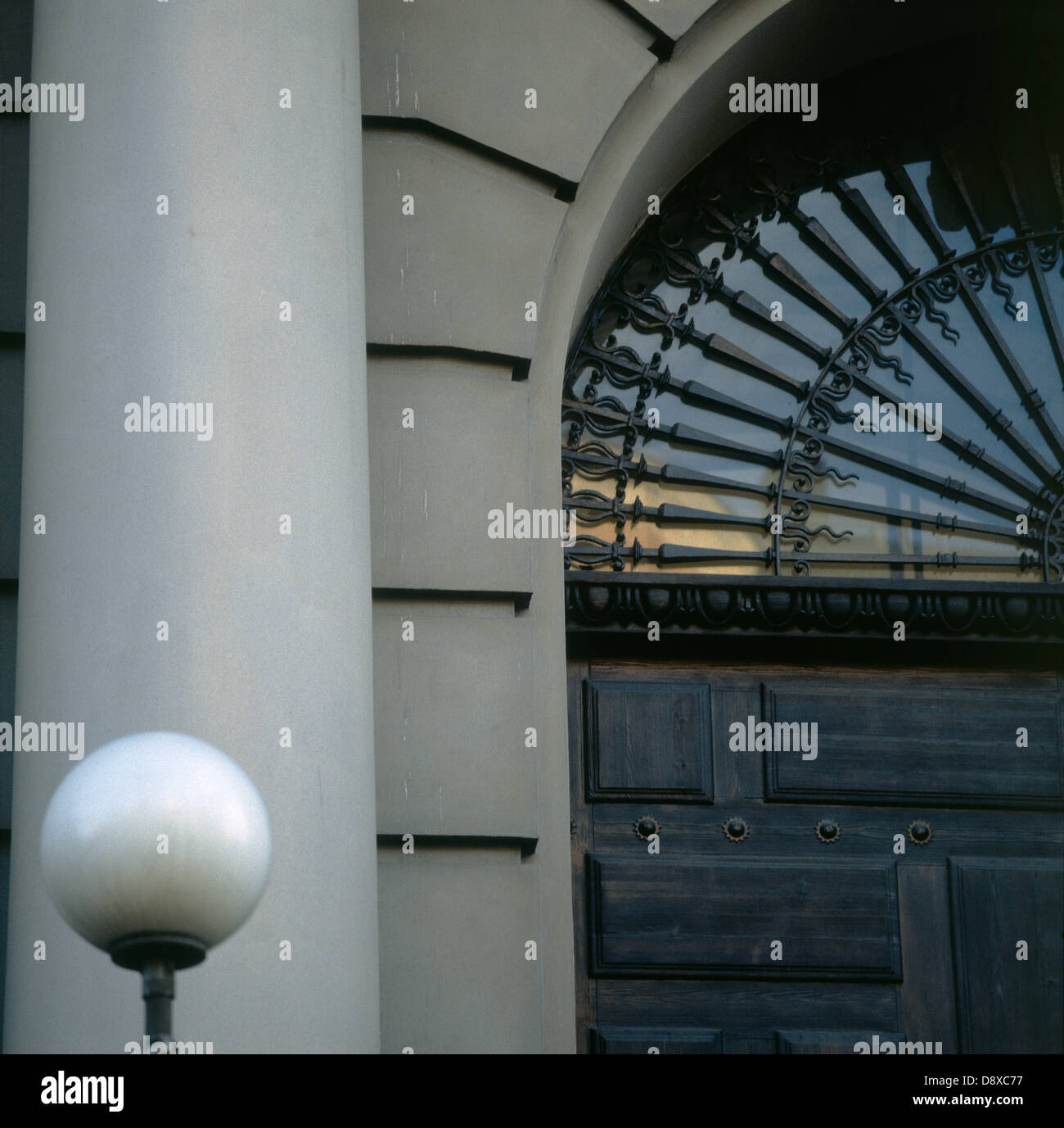 Column and lamp by entrance of building Stock Photo - Alamy