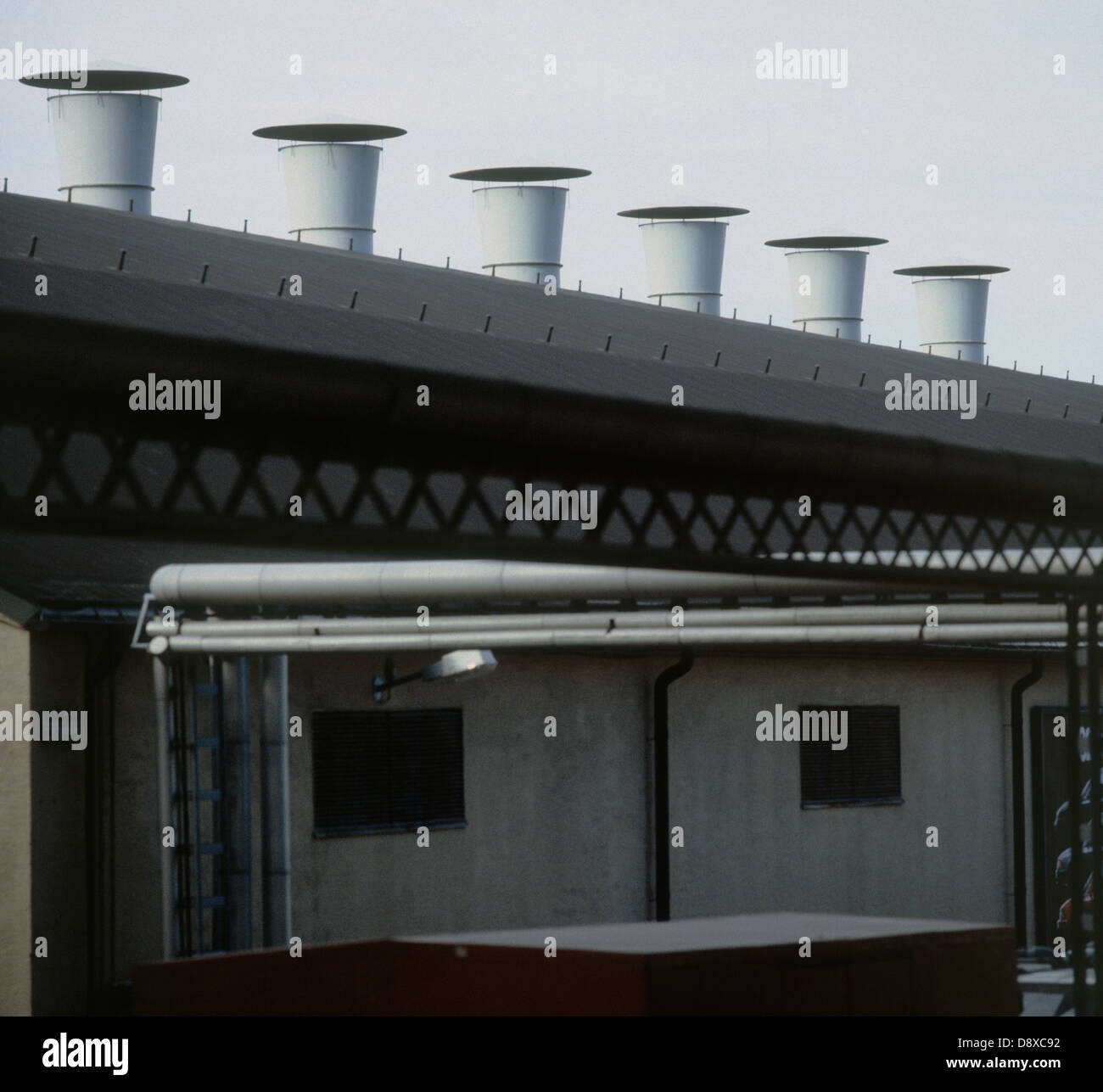 Chimneys on factory building (B&W Stock Photo - Alamy