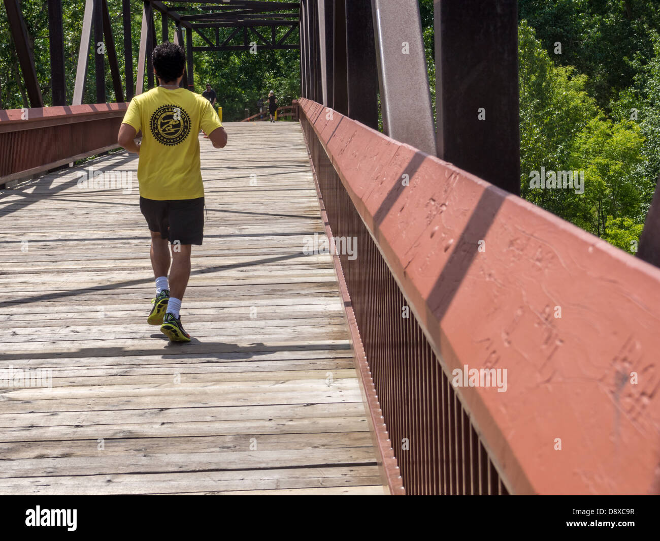 man running on bridge Stock Photo - Alamy
