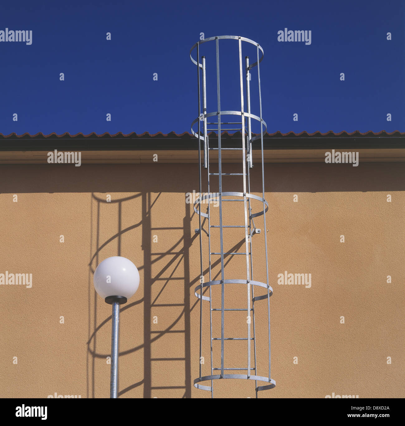 Ladder and lamp by wall Stock Photo - Alamy