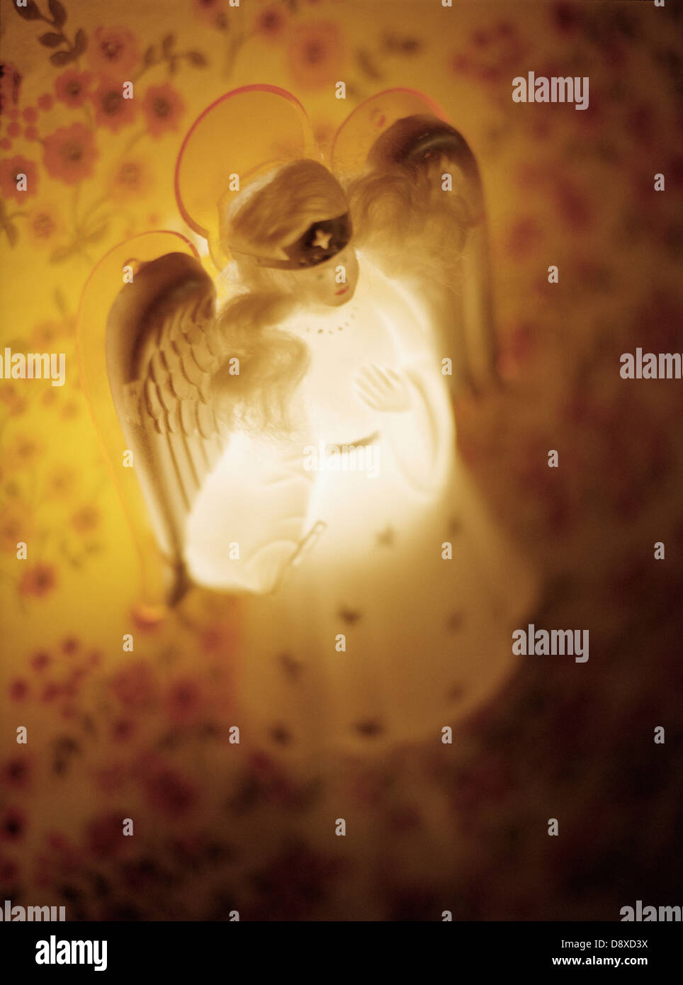 An angel hanging on a wall Stock Photo - Alamy