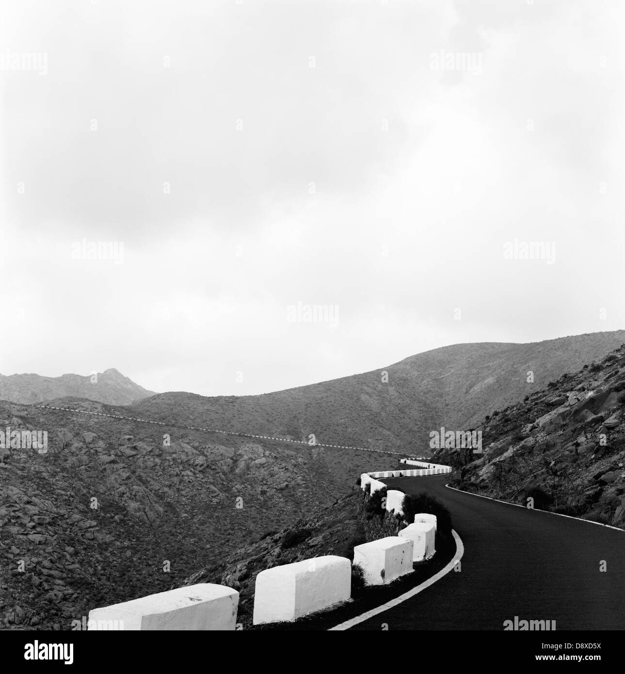 Highway through mountains (B&W Stock Photo - Alamy