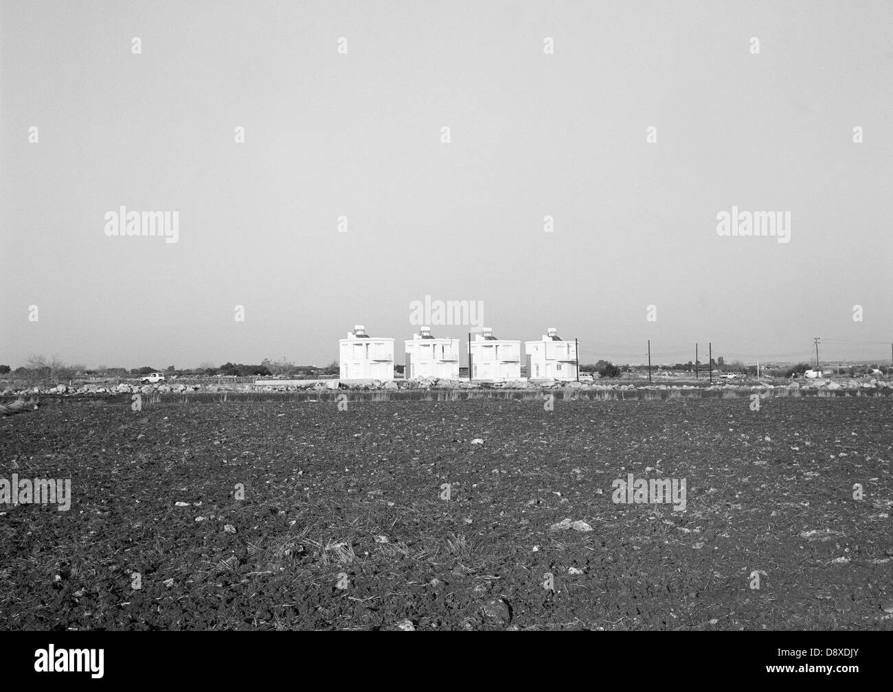 Field with buildings in background (B&W Stock Photo - Alamy