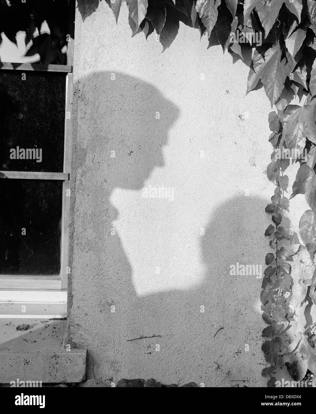 Shadow of people on wall (B&W Stock Photo - Alamy