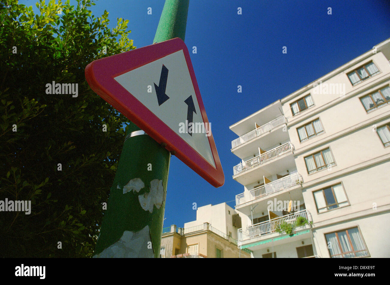 Arrow sign on post, low angle view Stock Photo - Alamy
