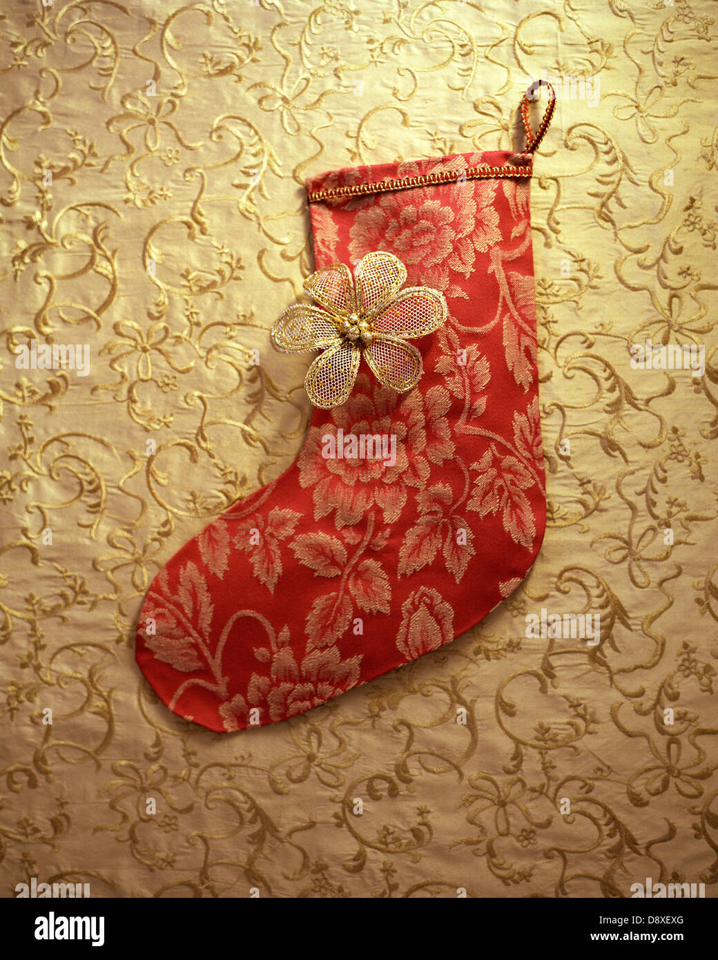 A red sock decorated with flowers Stock Photo - Alamy
