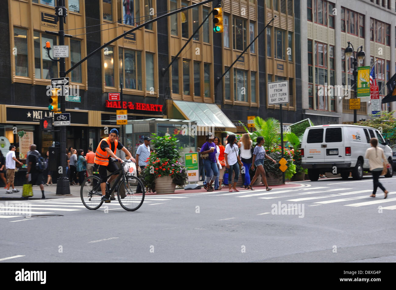 Bicyclist crossing a New York City intersection Stock Photo - Alamy