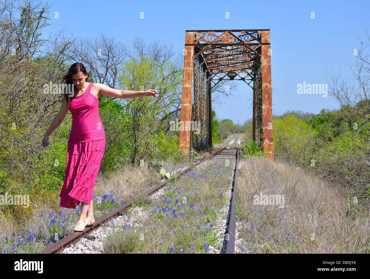 Girl walking on rail track hi-res stock photography and images - Alamy