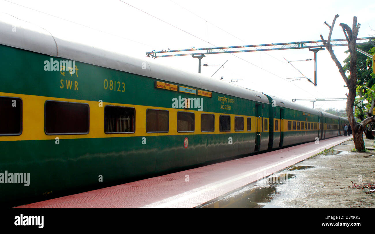 An Indian railways train (garib rath) at the Kochu veli railway station ...