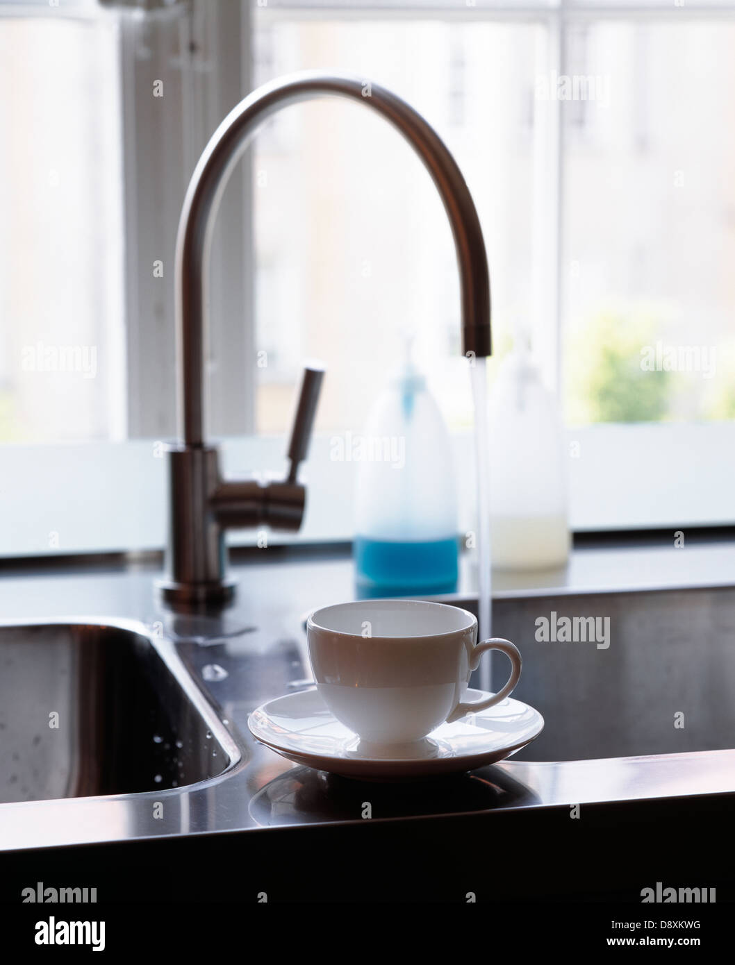 Pouring Water in a Water Tap Stock Photo - Alamy