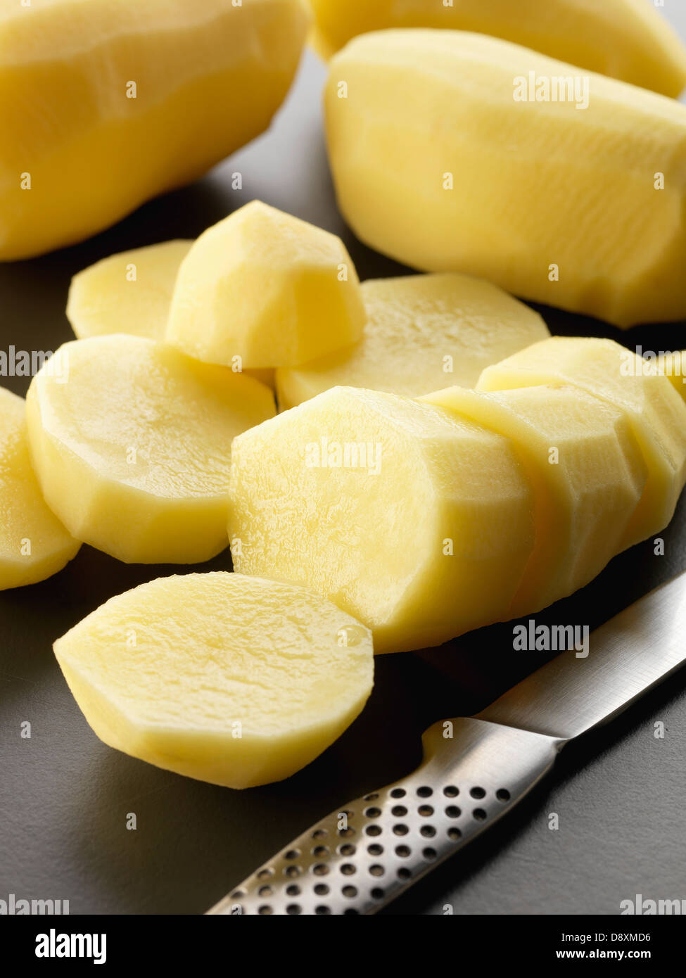 Cutting the peeled potatoes Stock Photo - Alamy