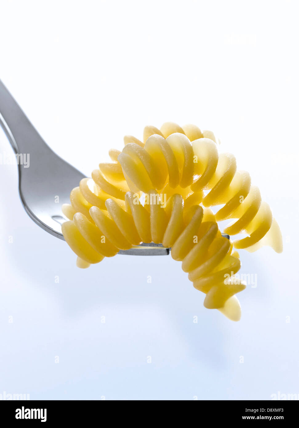 Fusilli on a fork Stock Photo - Alamy