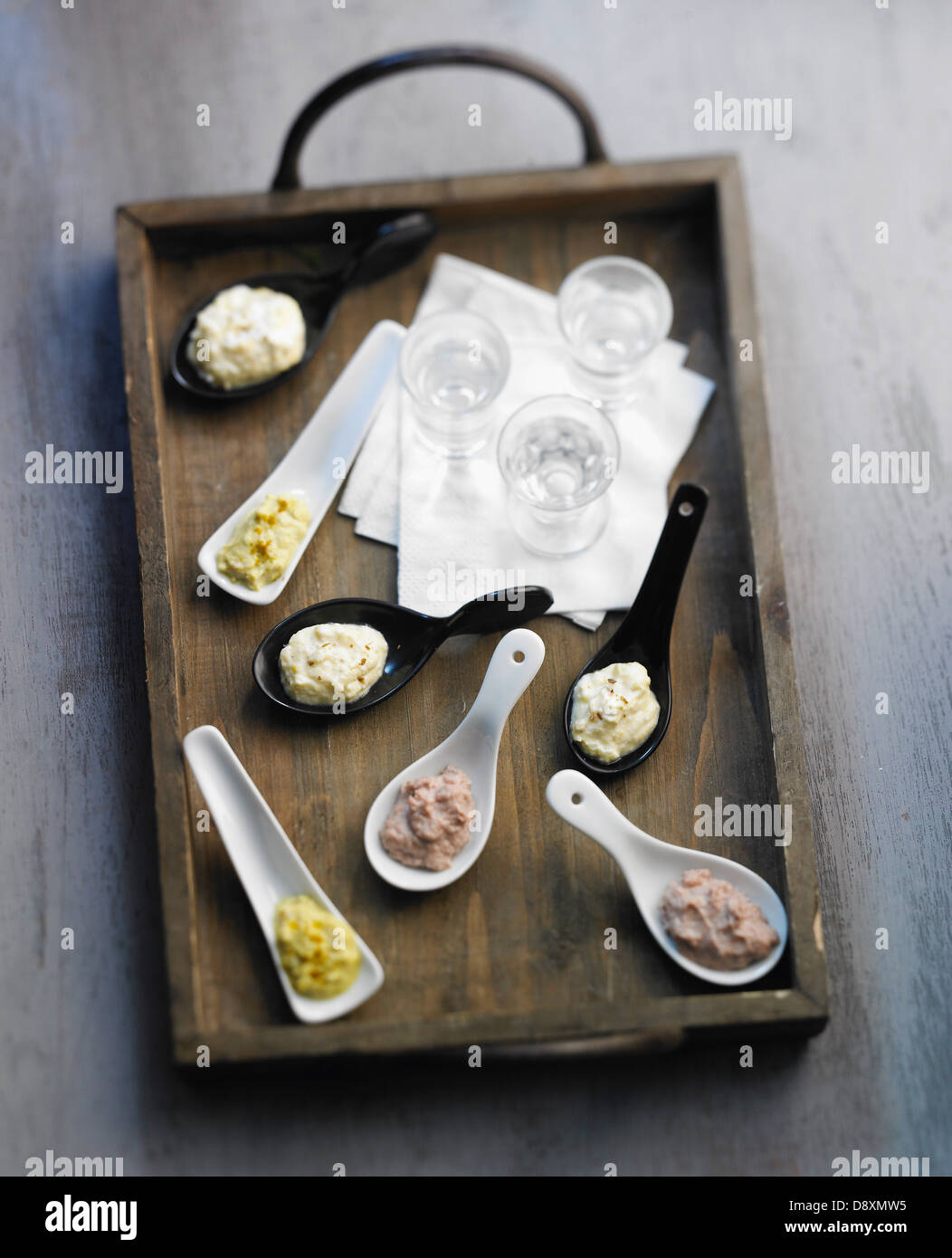 Spoonsful of appetizers Stock Photo - Alamy