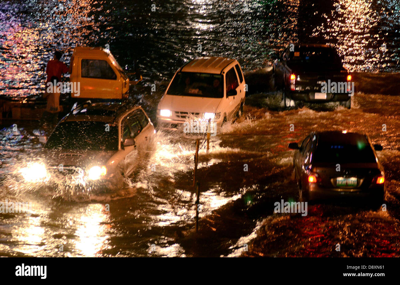 Davao, Philippines. 6th June 2013. Motorist pass on flood water cause ...