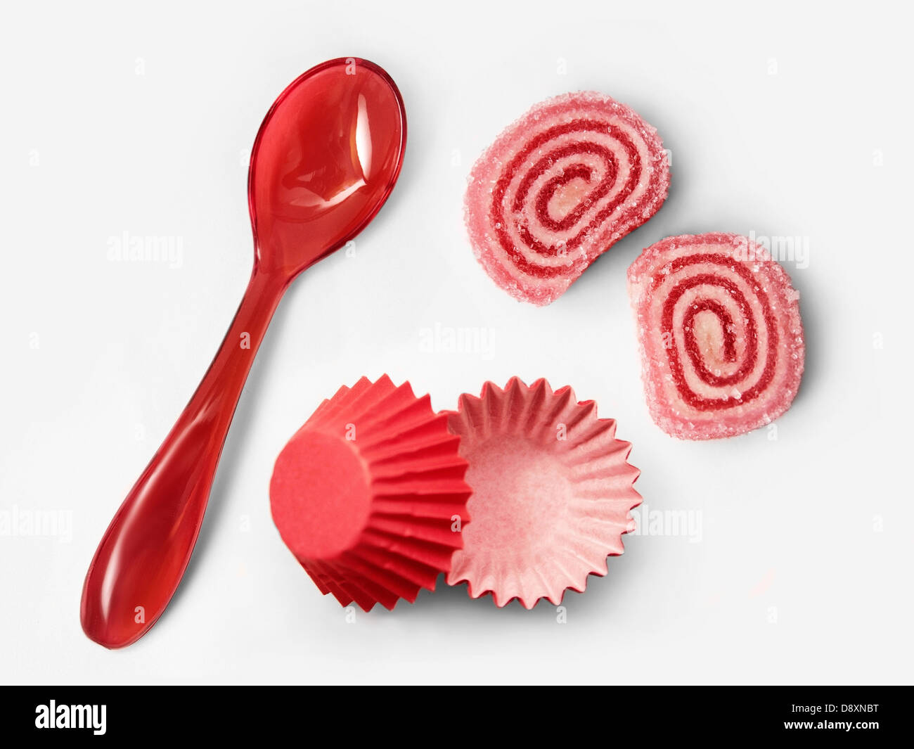 Raspberry rolled candies and paper cups Stock Photo - Alamy