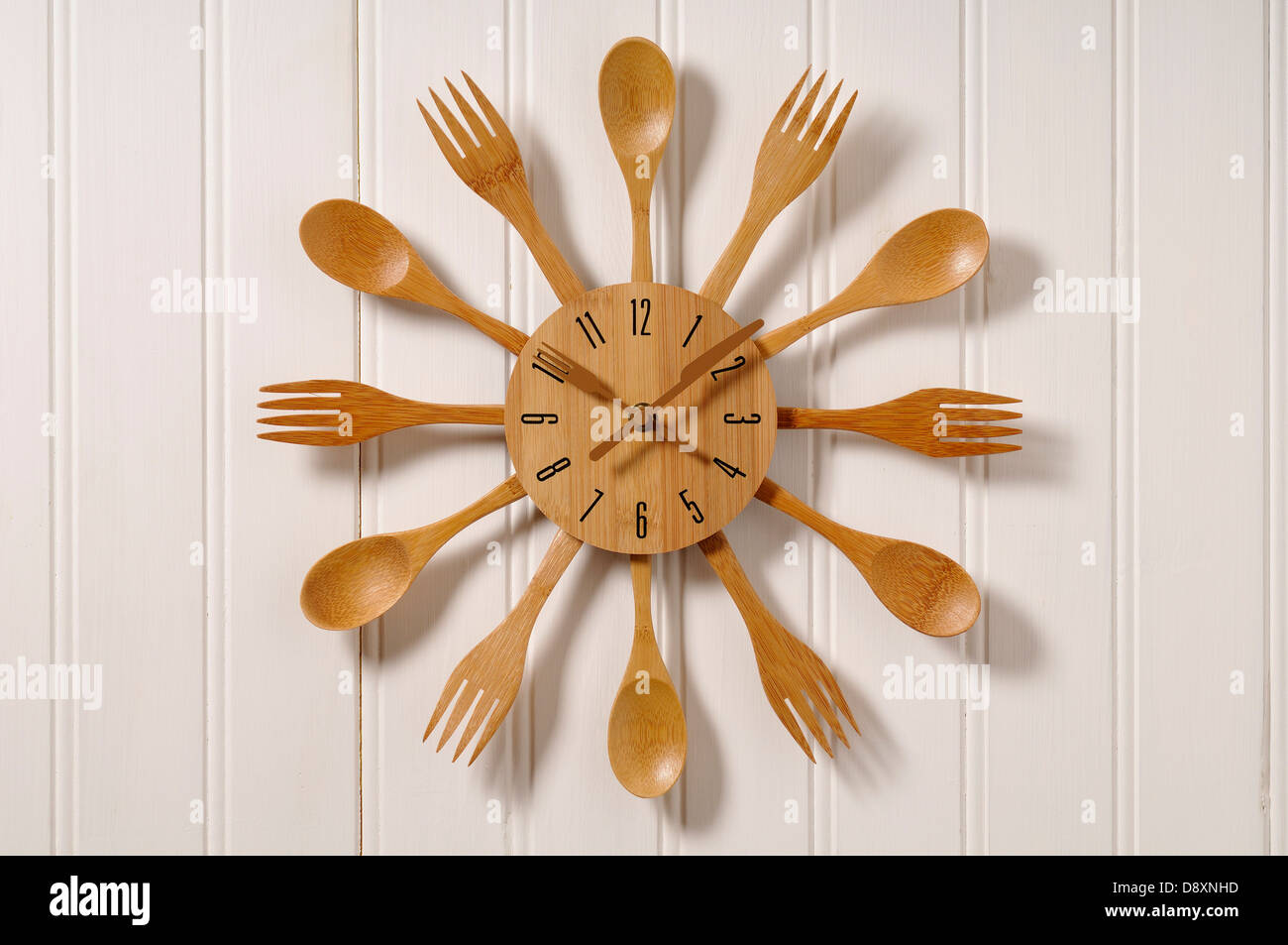 Clock made with wooden cutlery Stock Photo - Alamy