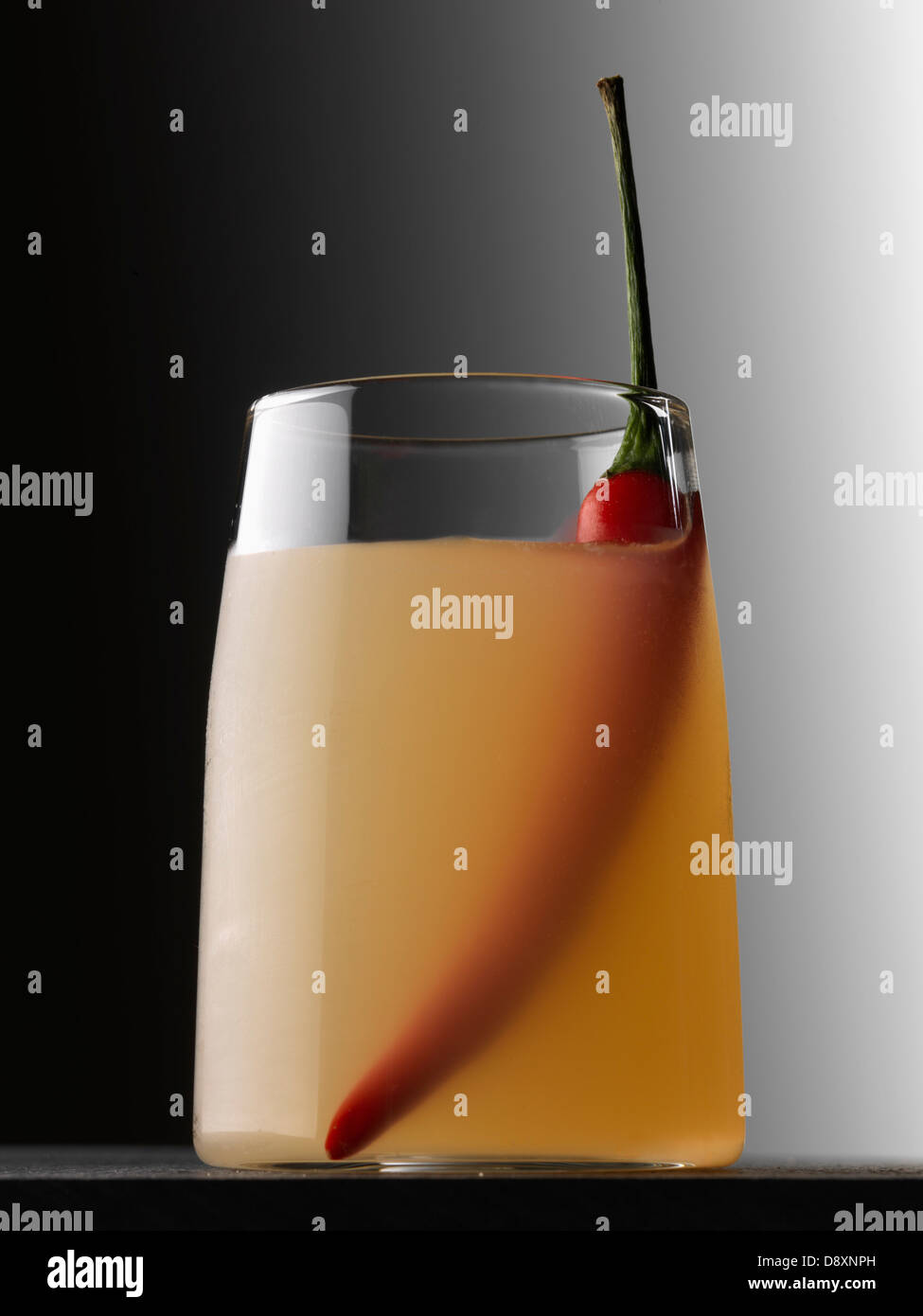 Vodka,orange and red hot pepper cocktail Stock Photo - Alamy