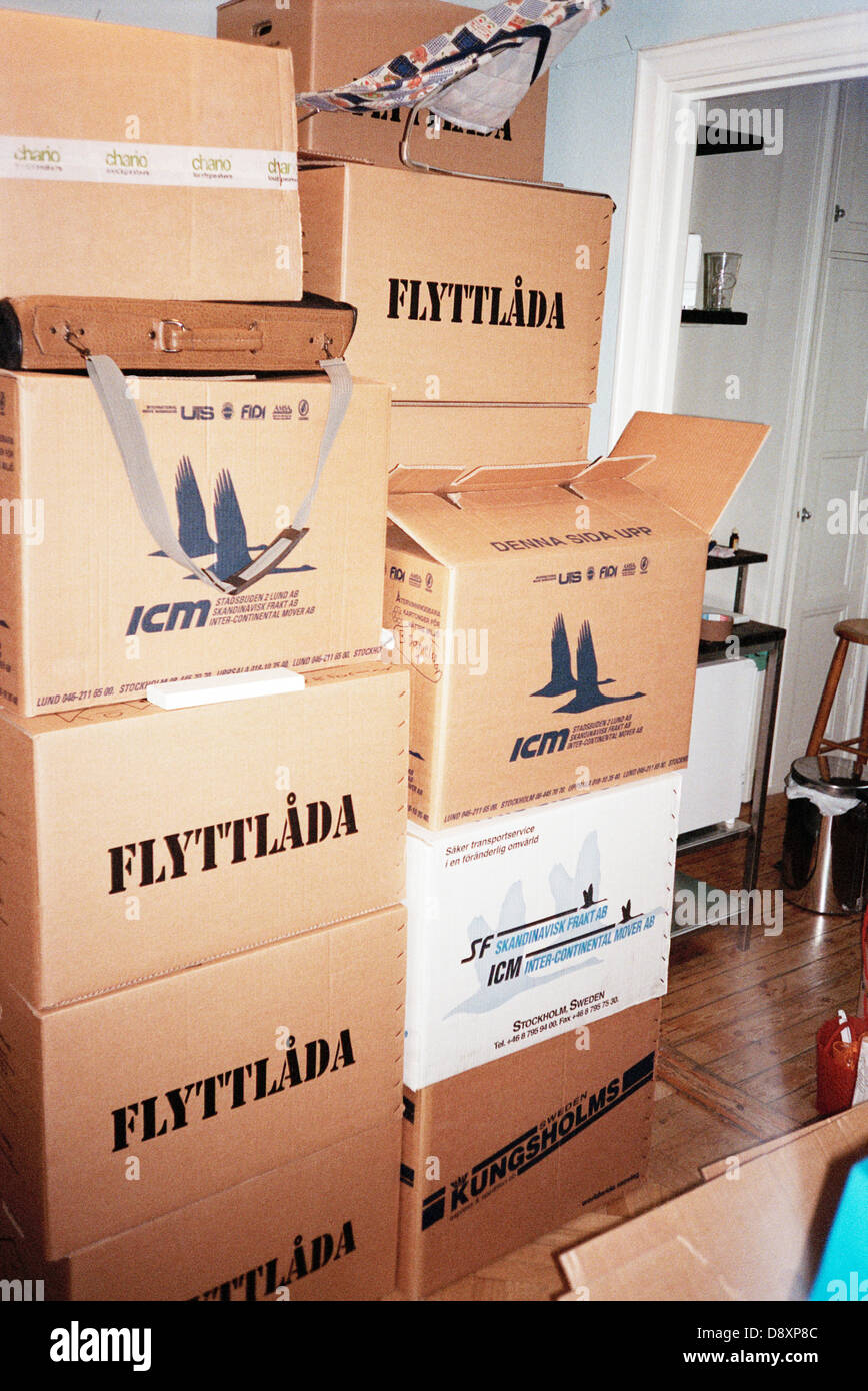 Boxes stacked in room Stock Photo - Alamy