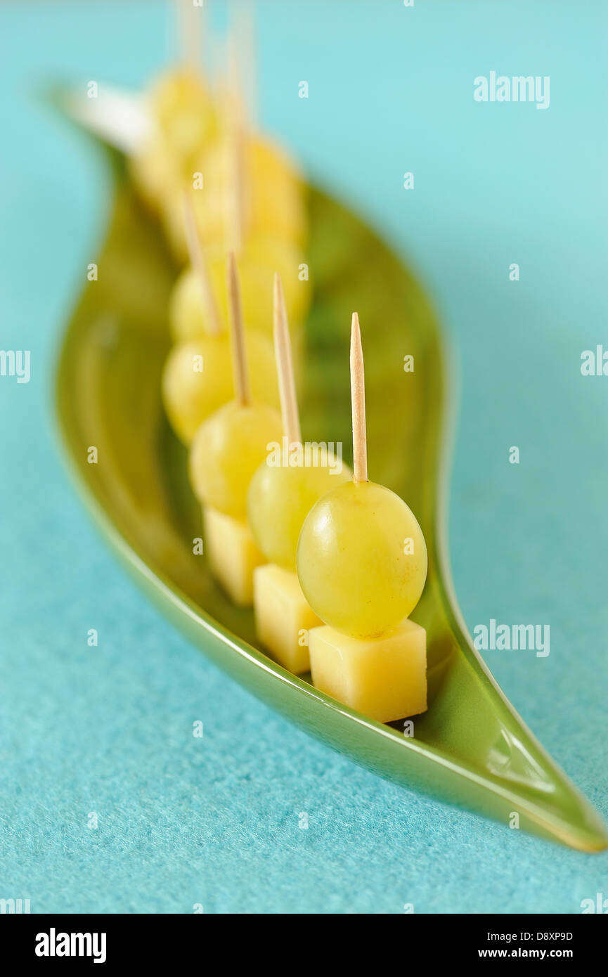 Comté and white grape bite-size appetizers Stock Photo - Alamy