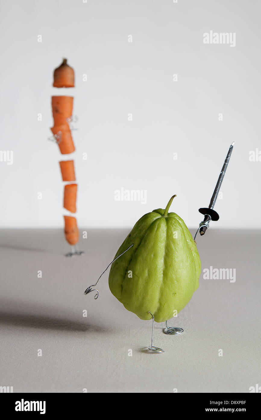 Fight between a carrot and a chayote Stock Photo - Alamy