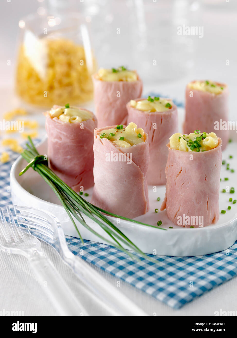 Boiled ham rolls filled with shell pasta with comté Stock Photo - Alamy
