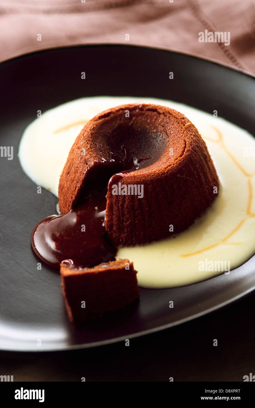 Chocolate fondante with custard Stock Photo - Alamy