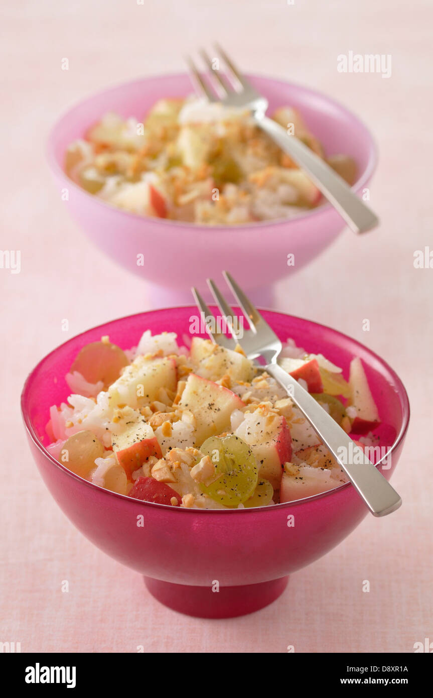 Long grain rice salad with apples,raisins and hazelnuts Stock Photo - Alamy