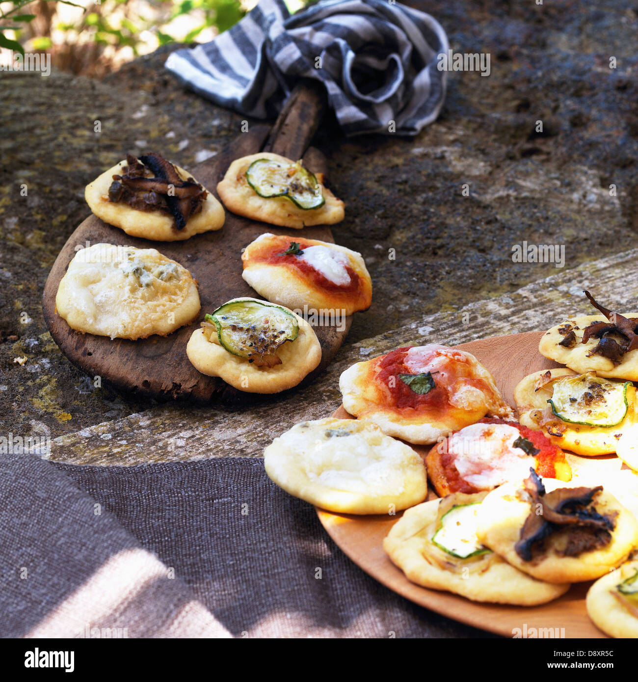 Assorted mini pizzas for an aperitif Stock Photo - Alamy
