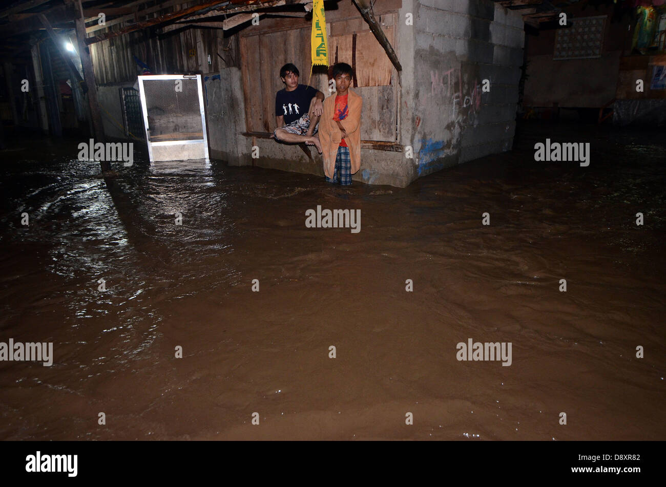 Davao, Philippines. 6th June 2013. Filipino stand and seat into their ...