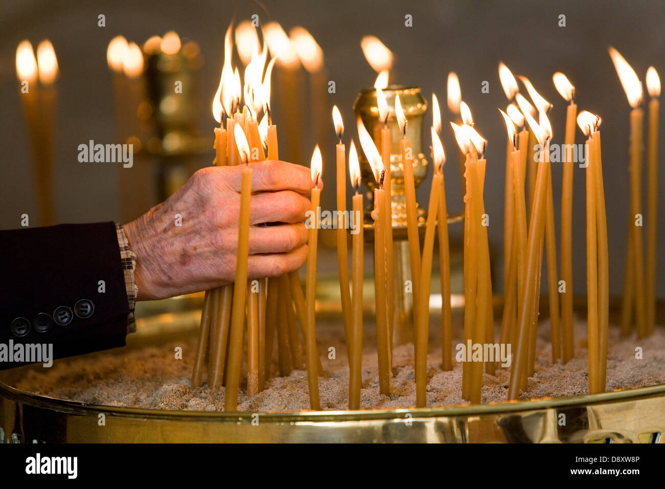 Candle group in a church Stock Photo - Alamy