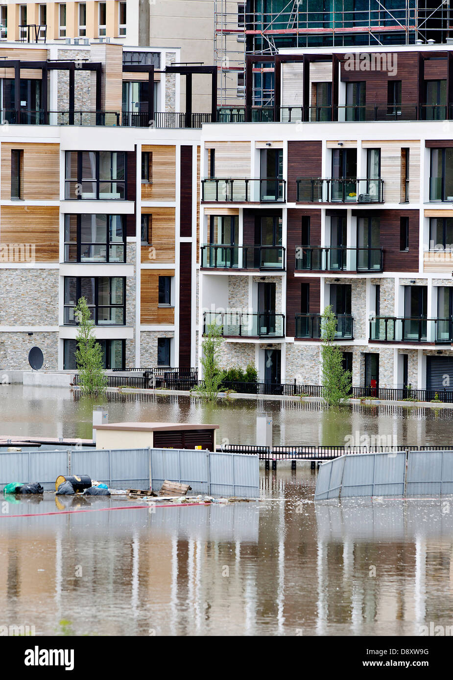 Brand new luxury Dock Residence in Prague Liben reflects in flood water ...