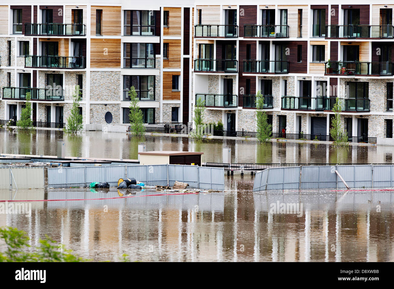 Brand new luxury Dock Residence in Prague Liben reflects in flood water ...