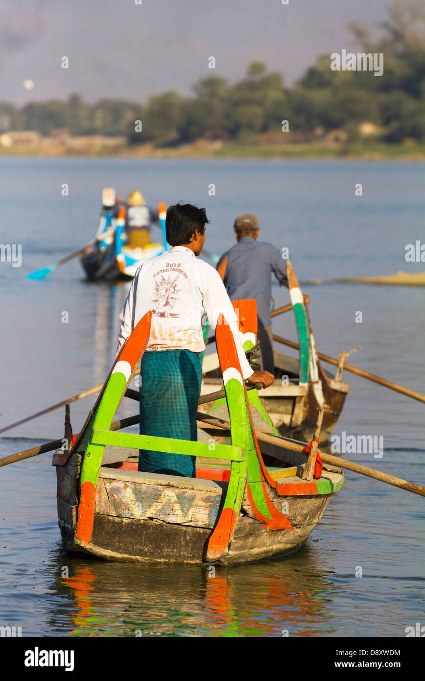 Tourist pleasure boats plying their trade by U Bein Teak Bridge across ...