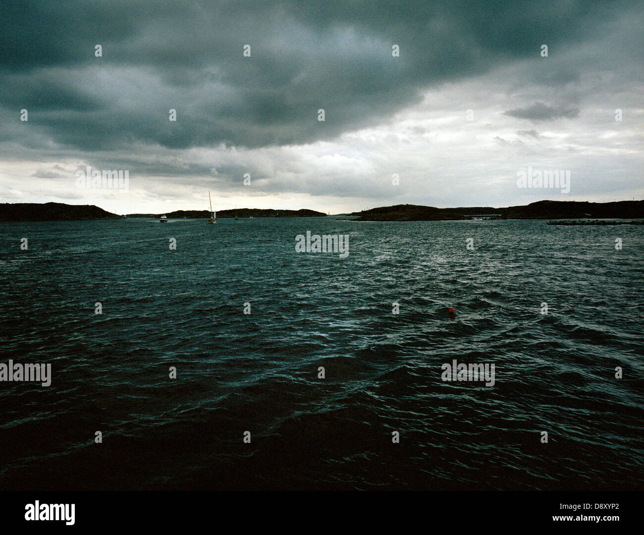 Dark clouds and the ocean Stock Photo - Alamy
