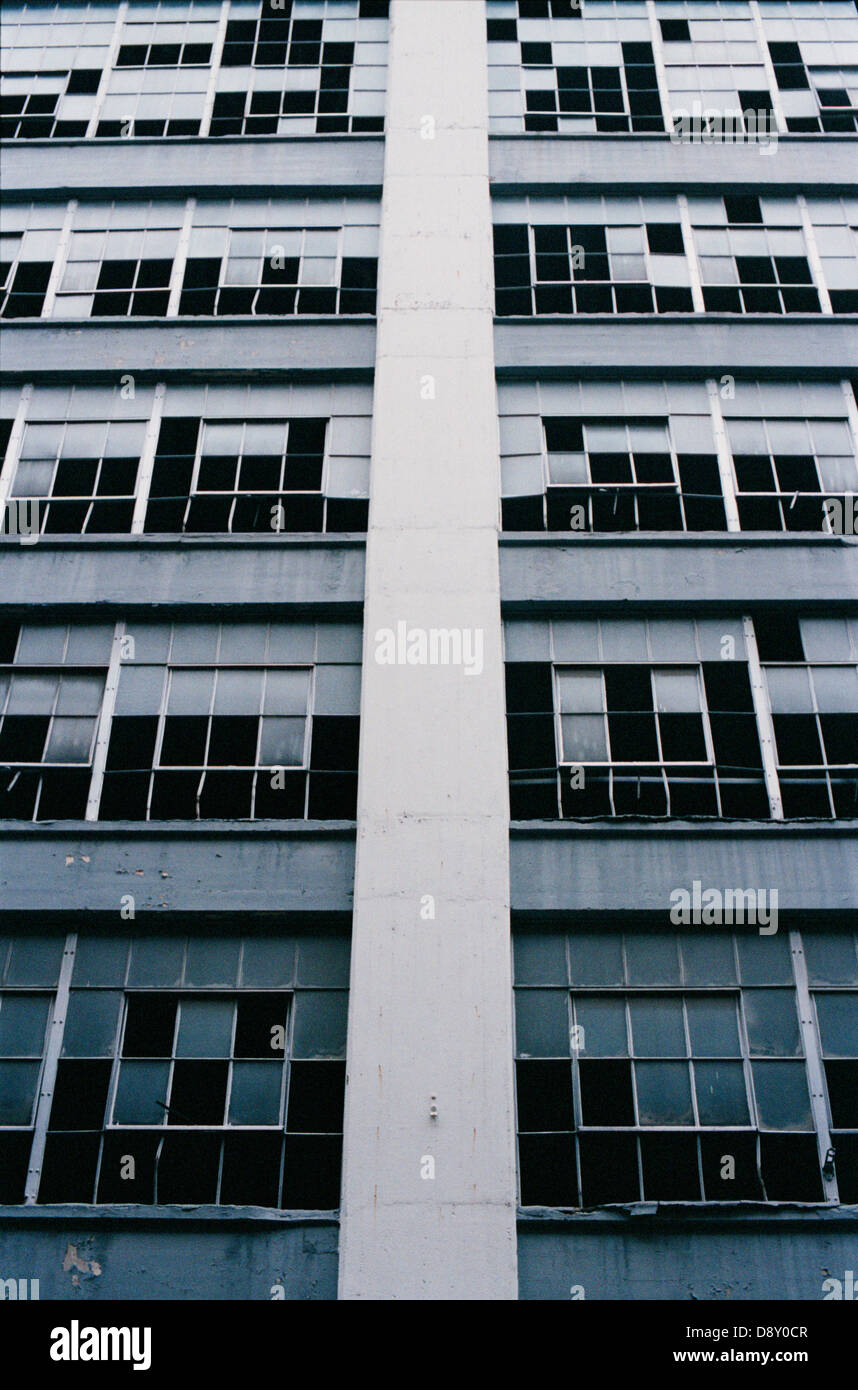 A building with broken windows Stock Photo - Alamy