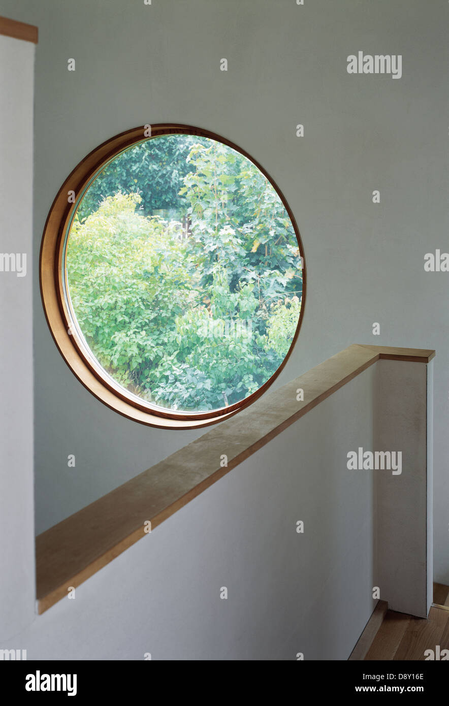 Round Window over Stairs in a House Stock Photo - Alamy