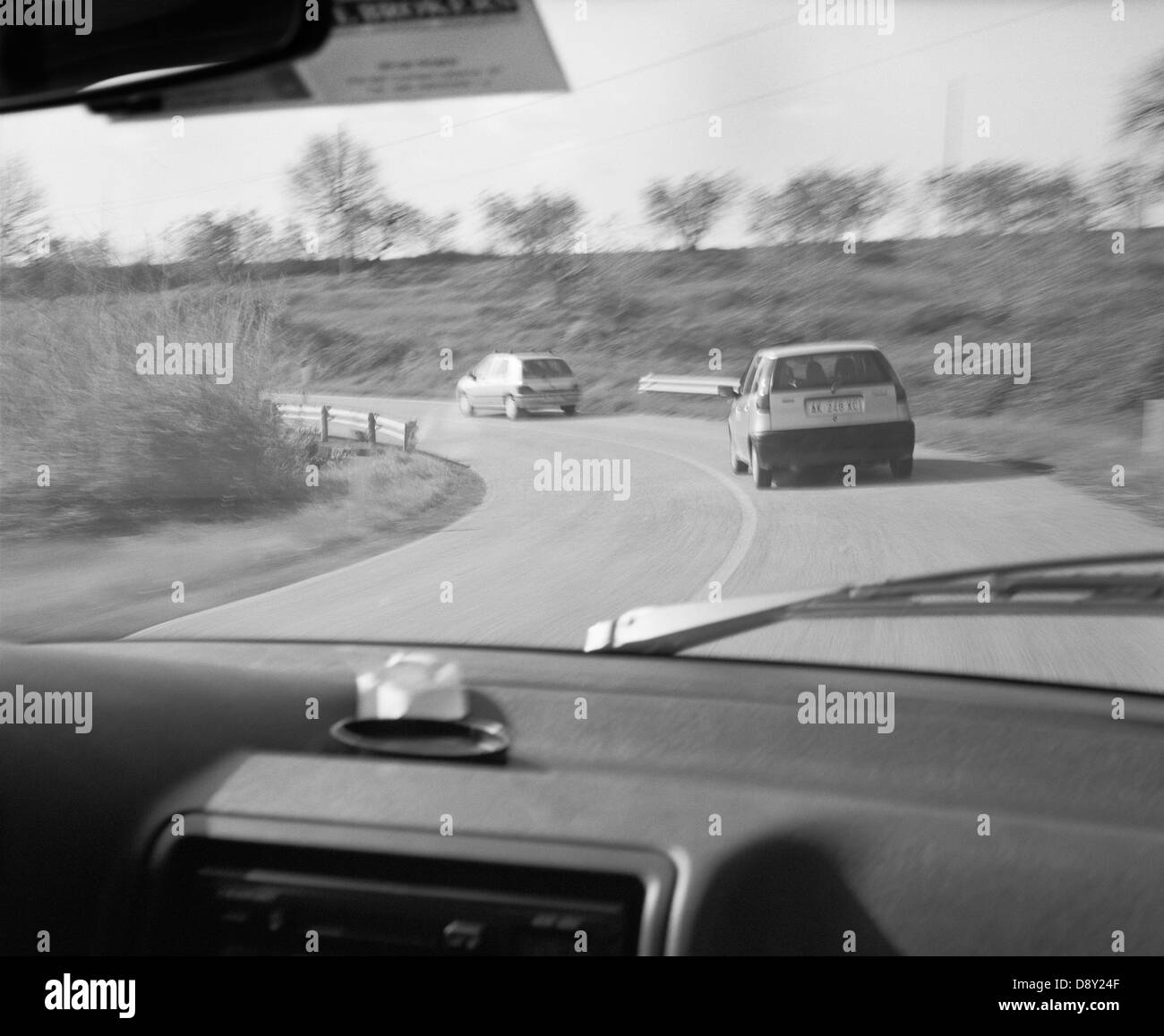 Cars on a country road Stock Photo - Alamy