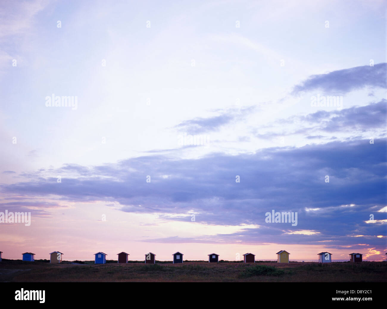 Bathing-huts in a row against a dusk sky Stock Photo - Alamy
