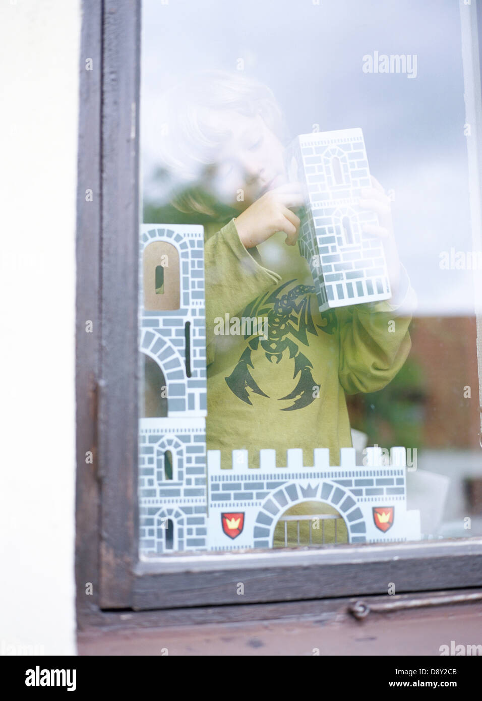 A boy that plays in a window Stock Photo - Alamy