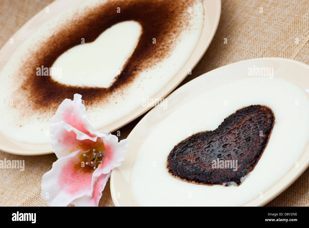 Two hearts in semolina pudding with flower of sugar Stock Photo - Alamy