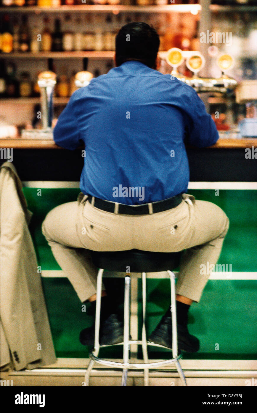 A man sitting in a bar Stock Photo - Alamy