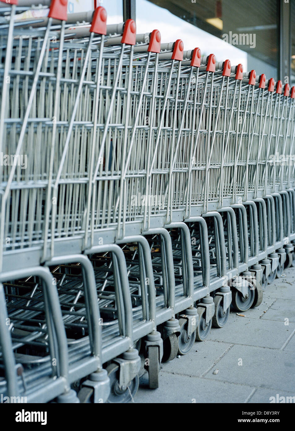 Shopping-carts in a row Stock Photo - Alamy