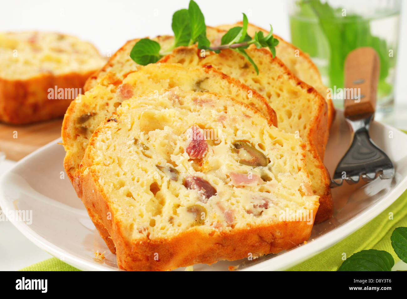 Slices of savory ham and olive cake Stock Photo - Alamy